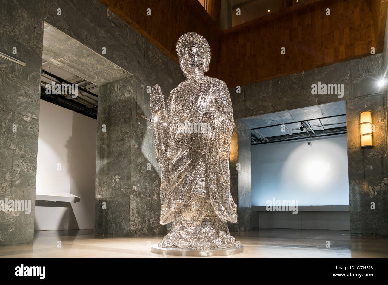 An artwork in the form of a Buddharupa named "Wenyu" is on display at ...