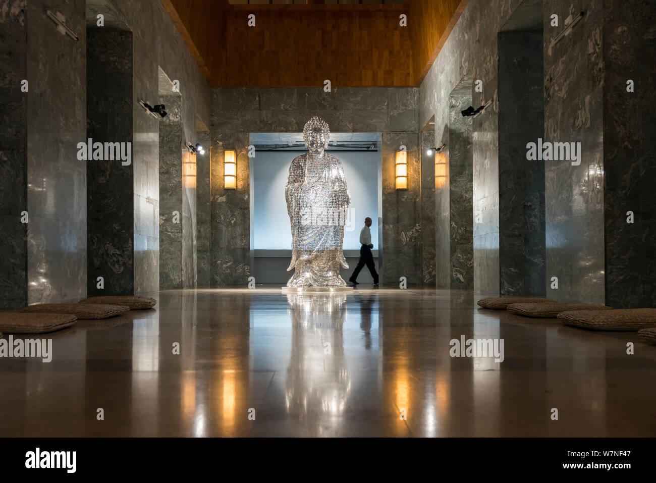 An artwork in the form of a Buddharupa named "Wenyu" is on display at ...