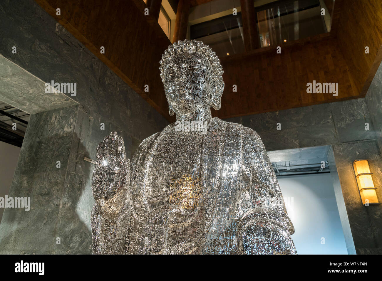An artwork in the form of a Buddharupa named "Wenyu" is on display at ...