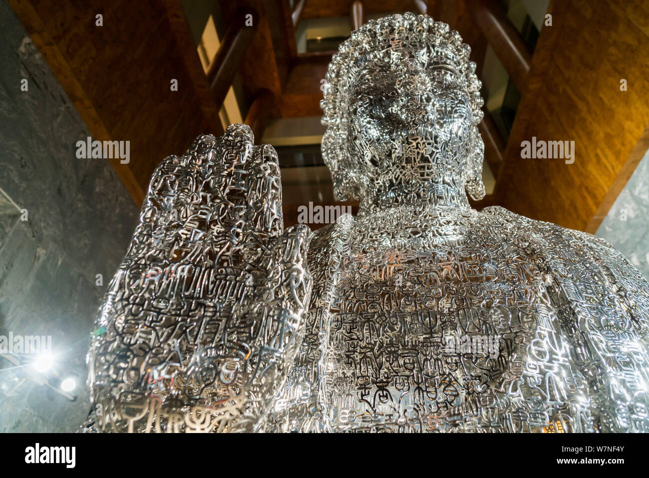 An artwork in the form of a Buddharupa named "Wenyu" is on display at ...