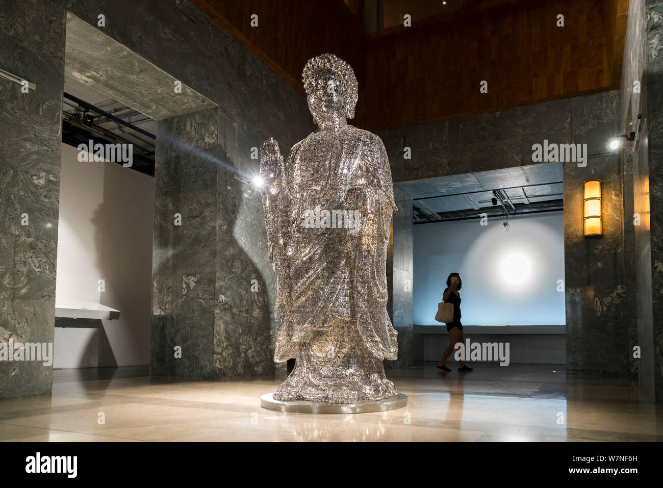 An artwork in the form of a Buddharupa named "Wenyu" is on display at ...