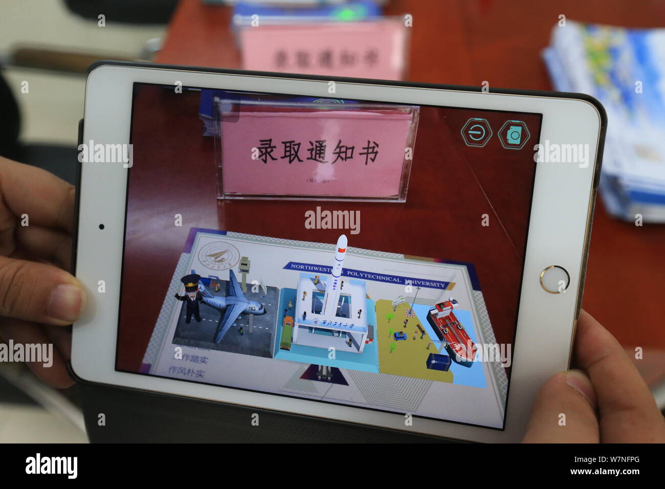 A teacher uses his ipad to scan the country's first offer via augmented ...