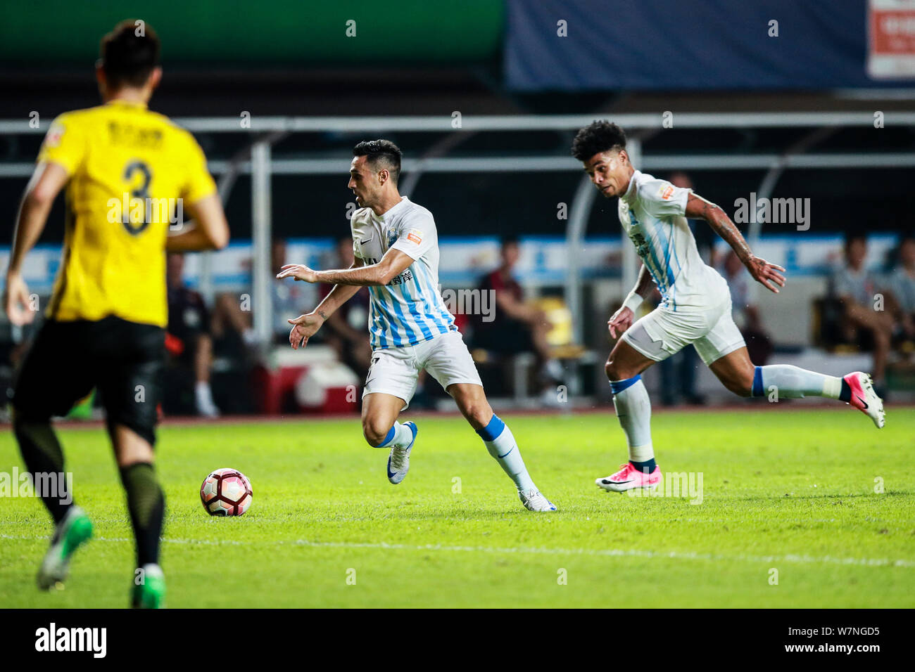 Israeli football player Eran Zahavi, left, of Guangzhou R&F kicks the ...
