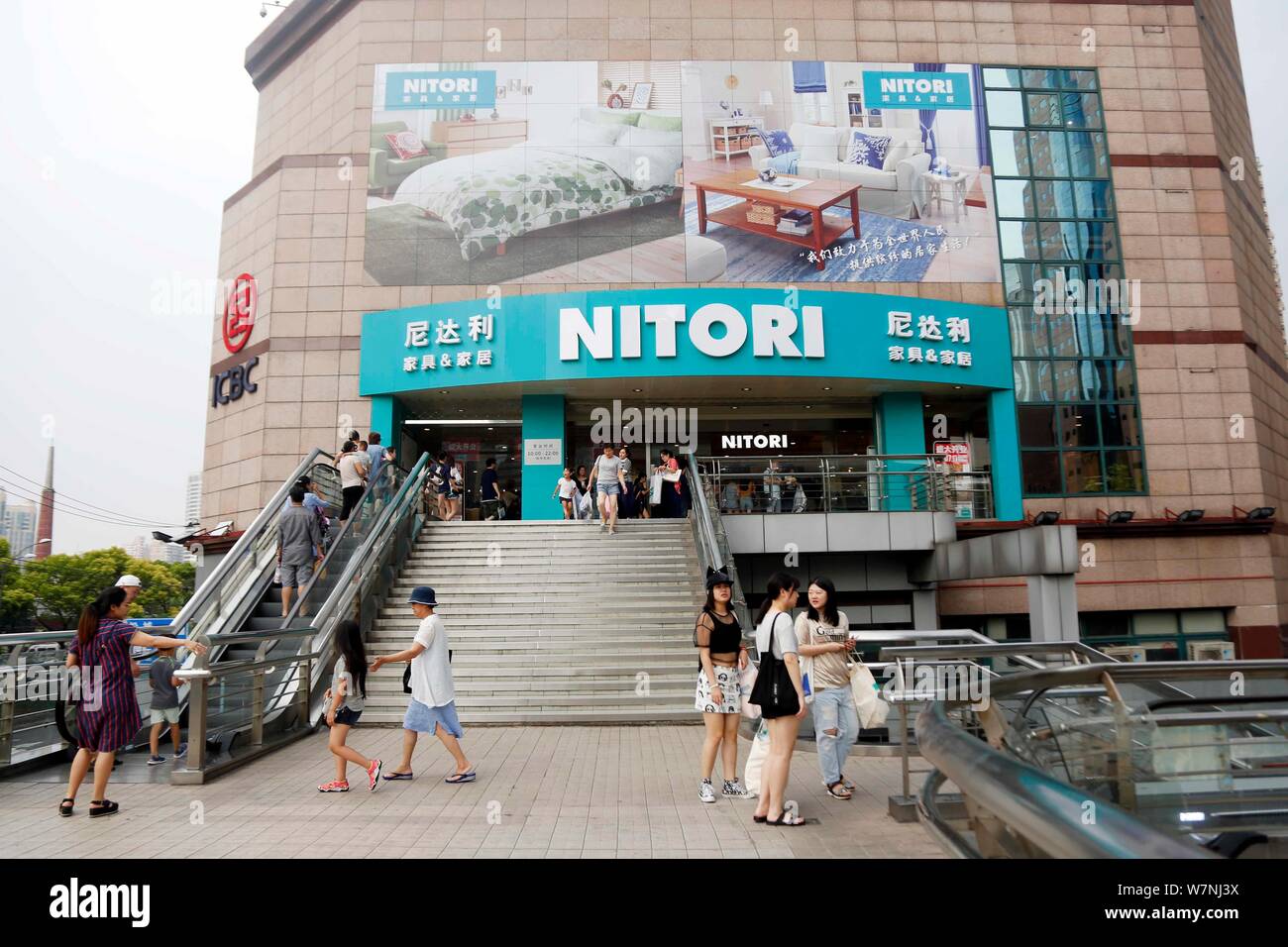 Chinese customers walk into the first flagship store of Japanese furniture and home decoration ...
