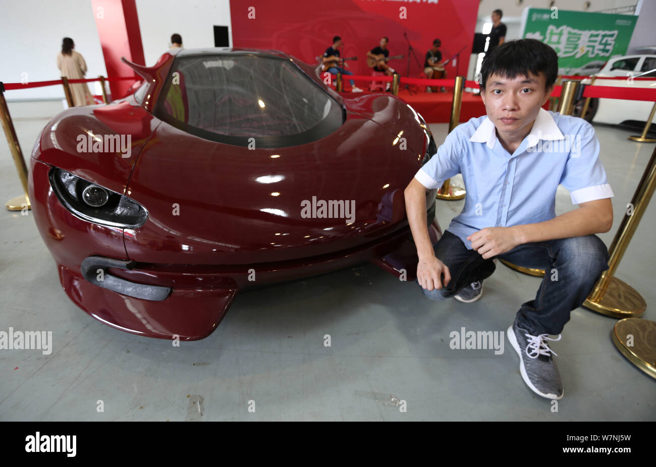 Chinese car enthusiast Chen Yinxi poses with his new generation ...