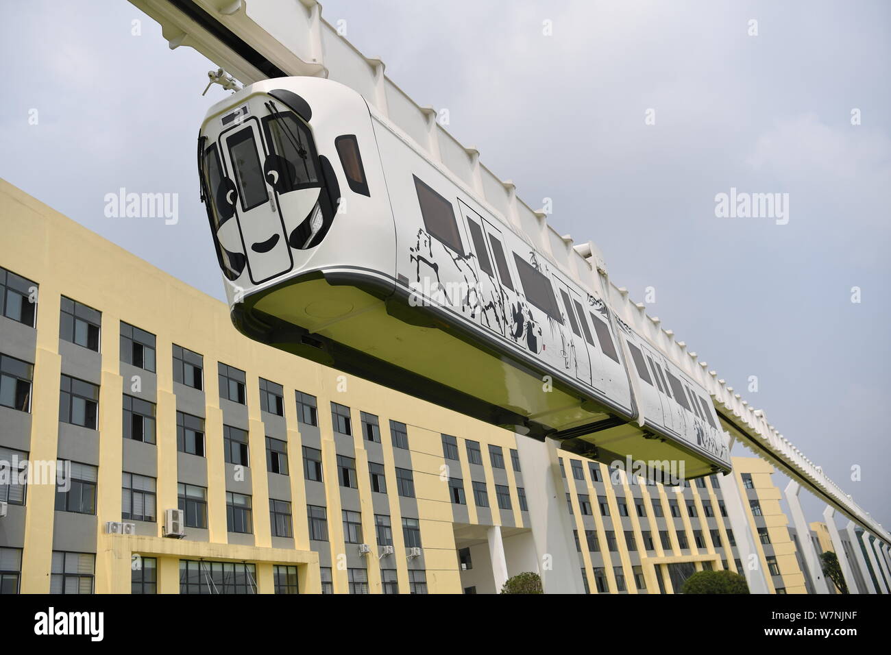 An elevated new energy monorail train travels along a 1.4km air rail at ...