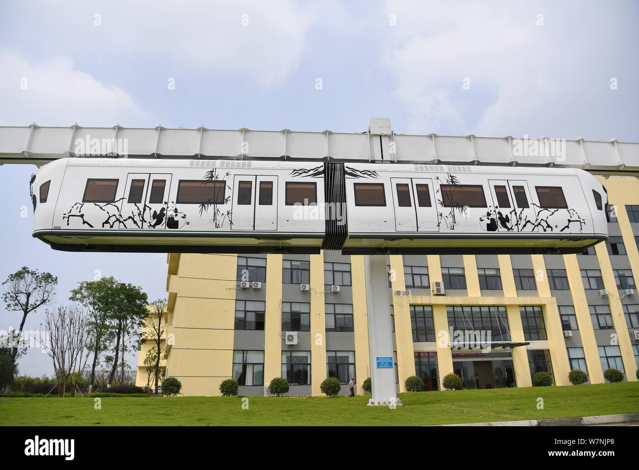 An elevated new energy monorail train travels along a 1.4km air rail at ...