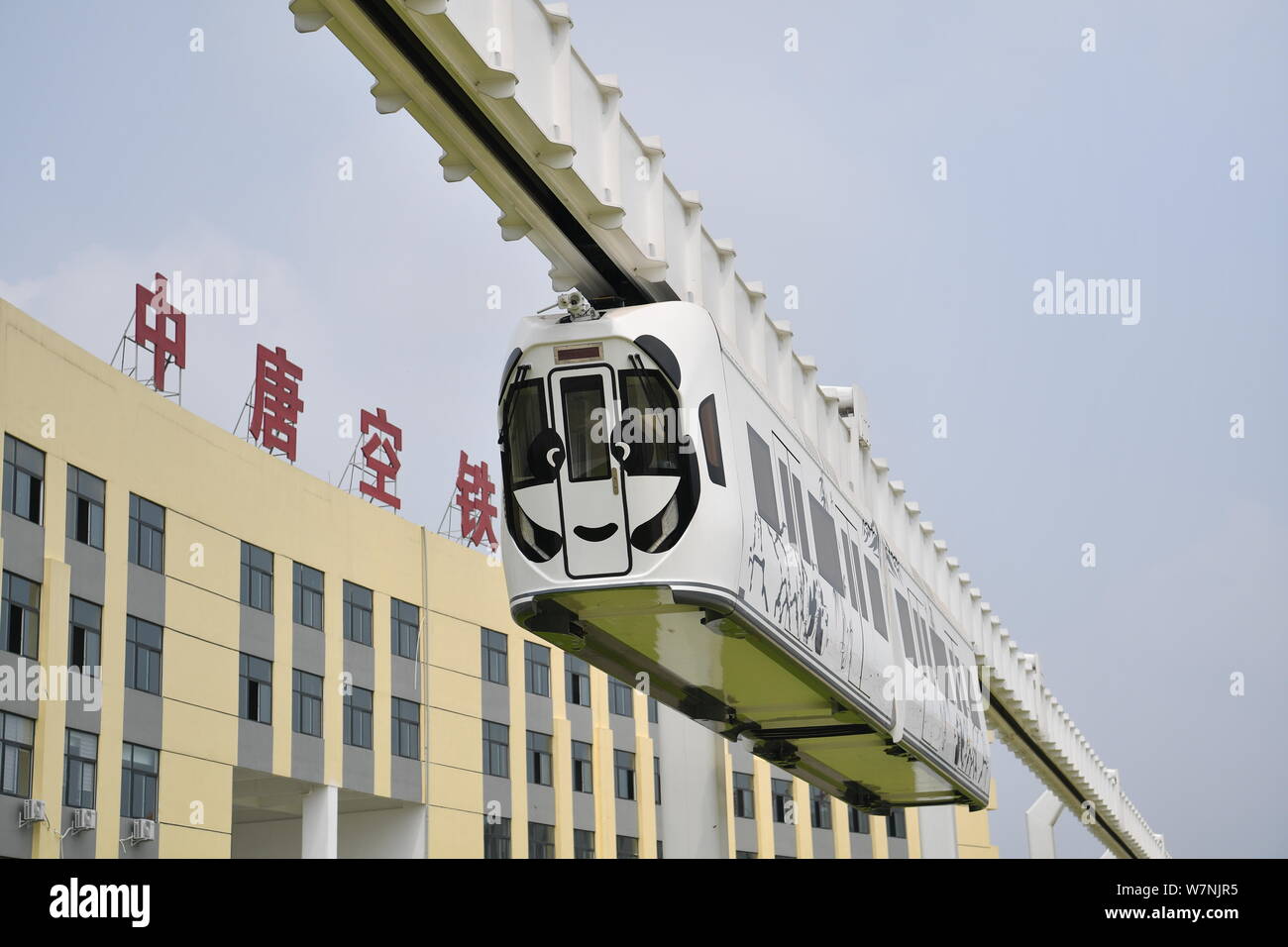 An elevated new energy monorail train travels along a 1.4km air rail at ...