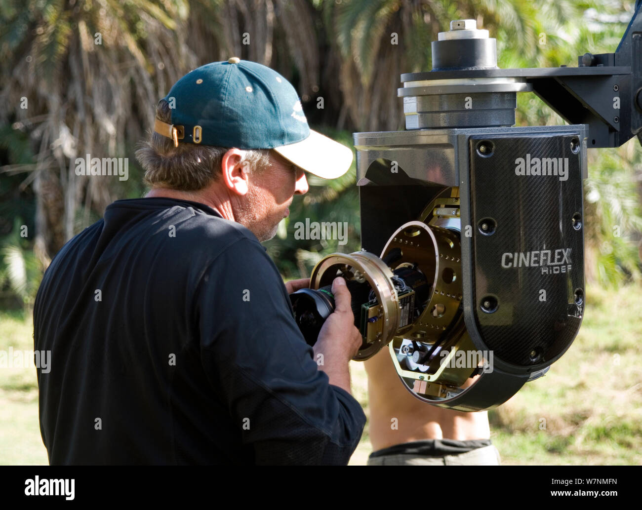 Simon Werry rigging Cineflex 'yogicam' in back of vehicle. Amboseli ...
