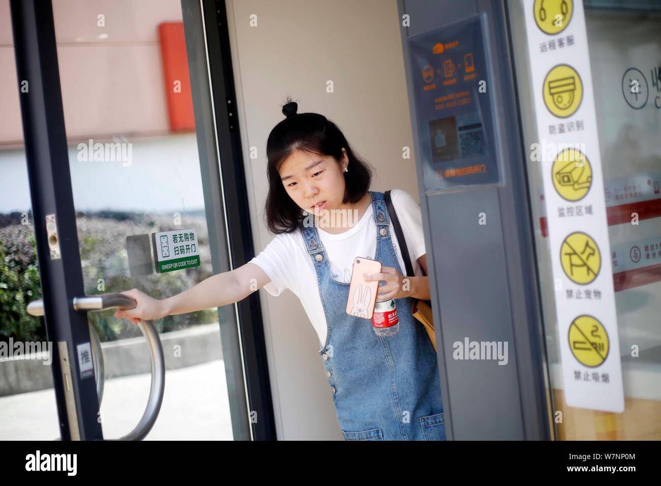 A customer leaves the BingoBox, an unmanned 24-hour and self-service ...