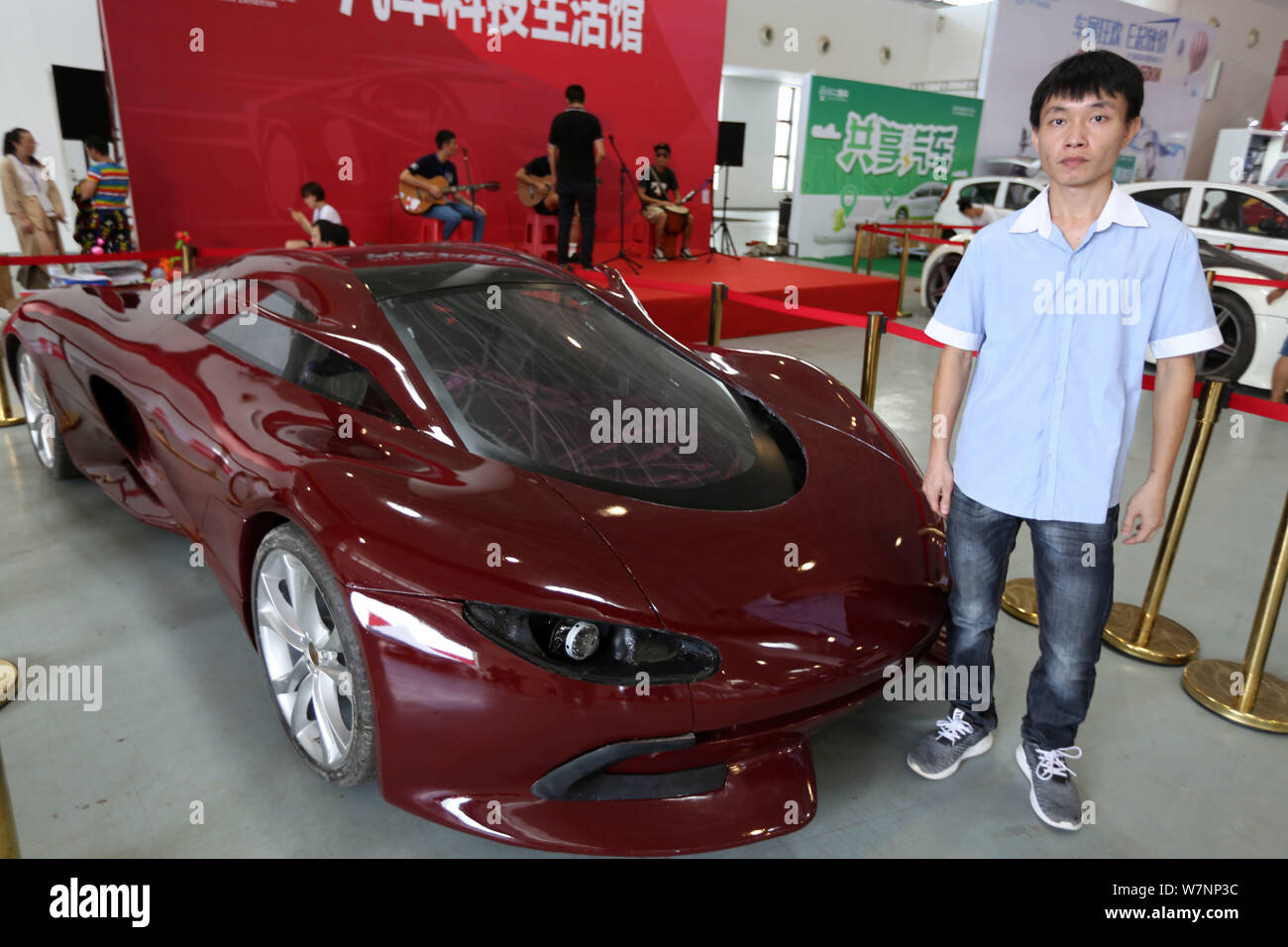 Chinese car enthusiast Chen Yinxi poses with his new generation ...