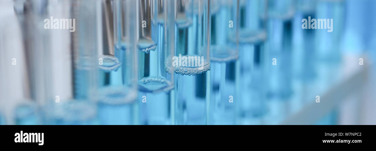 Test tube of glass overflows liquid solution potassium Stock Photo - Alamy