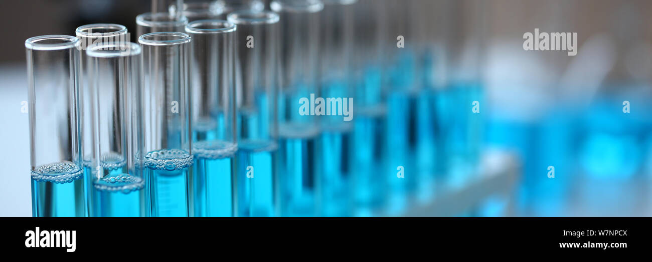 Test tube of glass overflows liquid solution potassium Stock Photo - Alamy