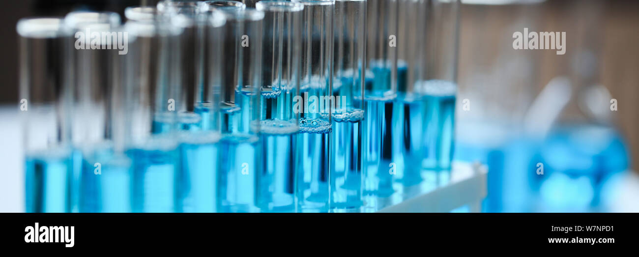 Test tube of glass overflows liquid solution potassium Stock Photo - Alamy