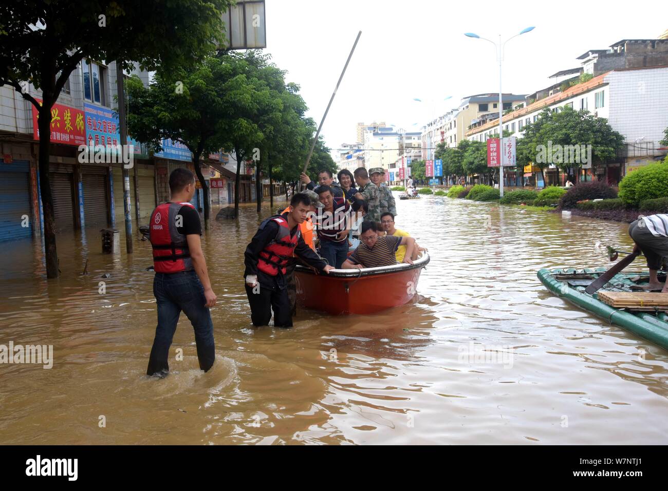 Chinese rescuers evacuate local residents by inflatable life boat from ...