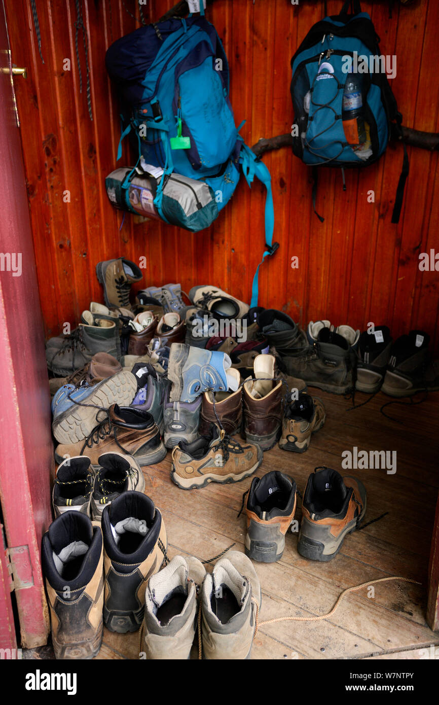 Hiking boots and backpacks at the entrance of Grey mountain hut ...