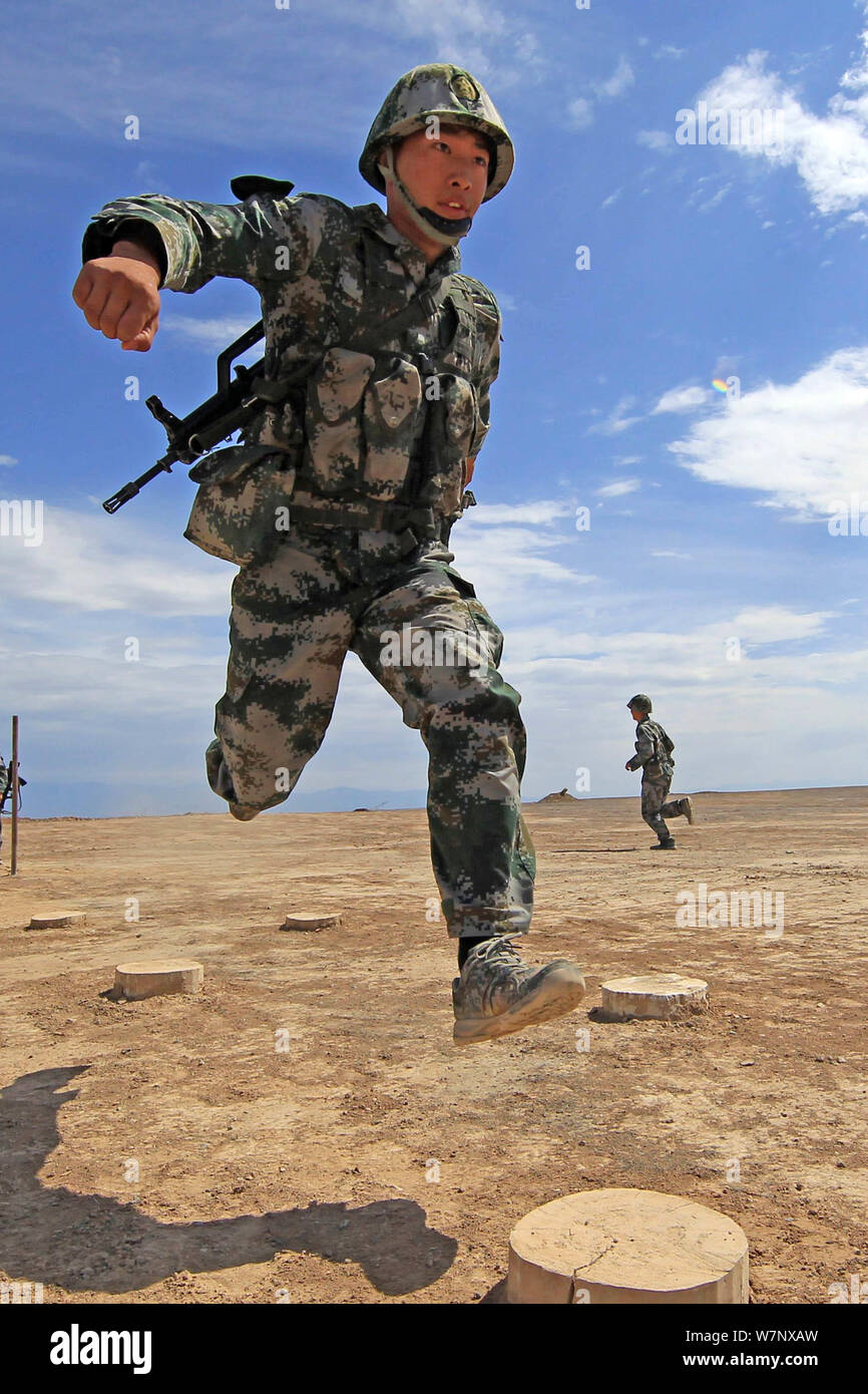A Chinese soldier of the PLA (People's Liberation Army) takes part in a ...
