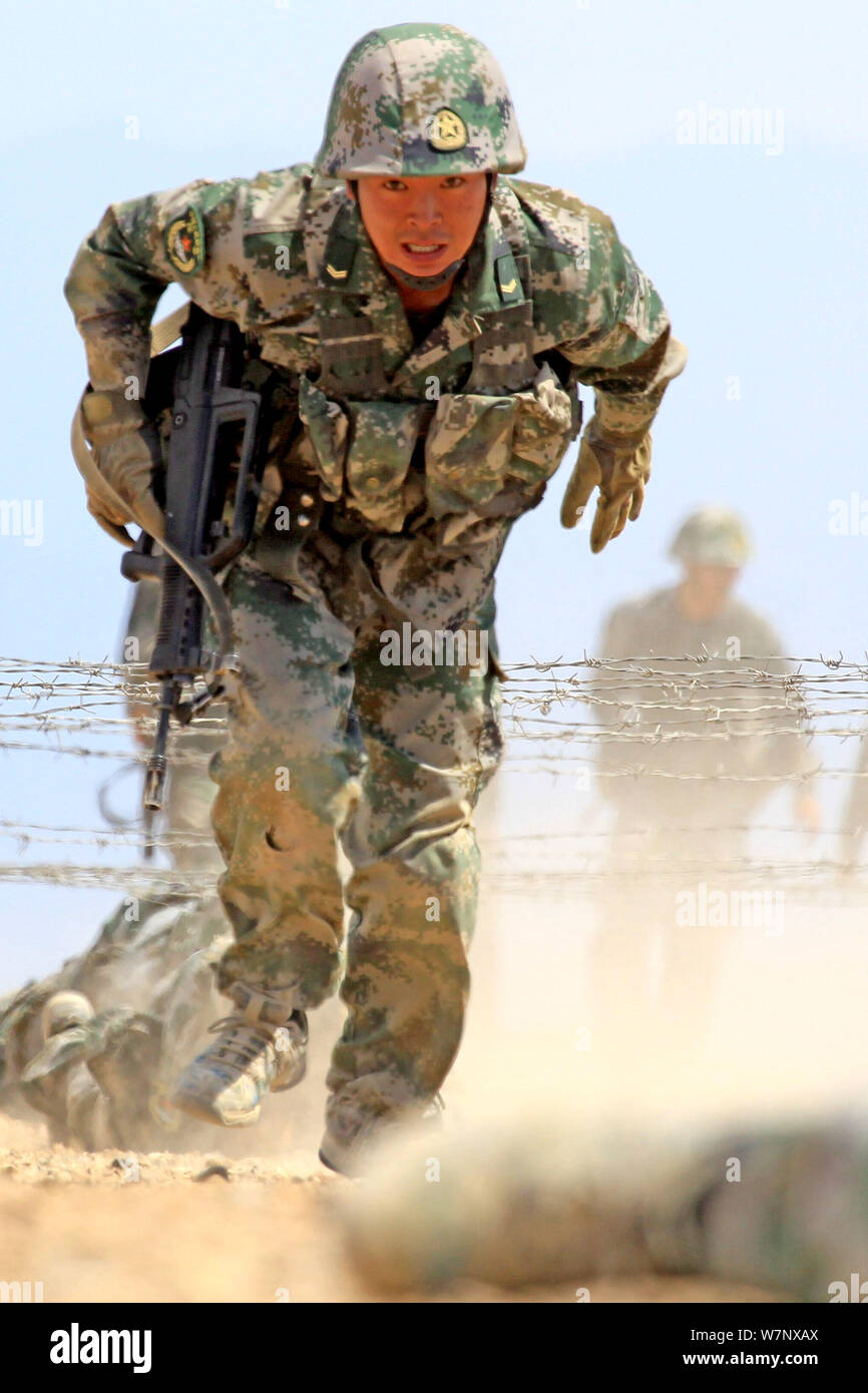 A Chinese soldier of the PLA (People's Liberation Army) takes part in a ...