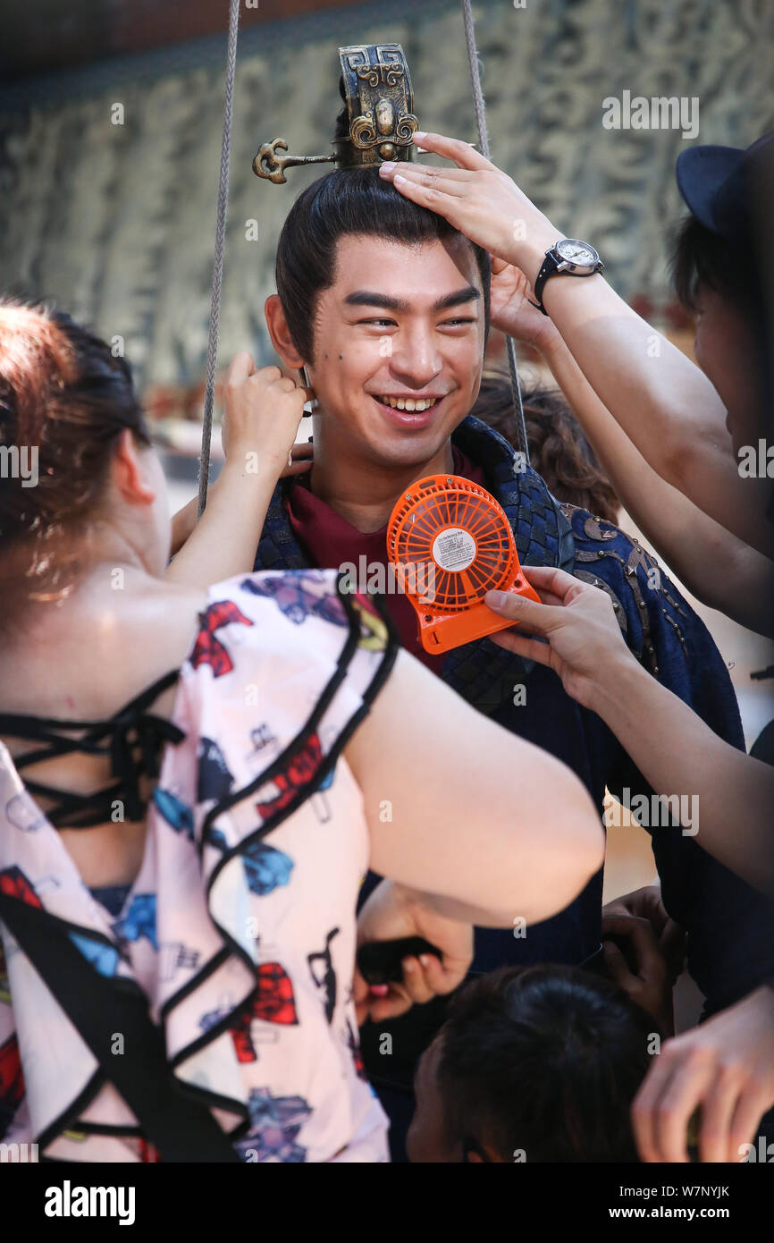 Taiwanese actor Chen Bolin is pictured during a filming session on set ...