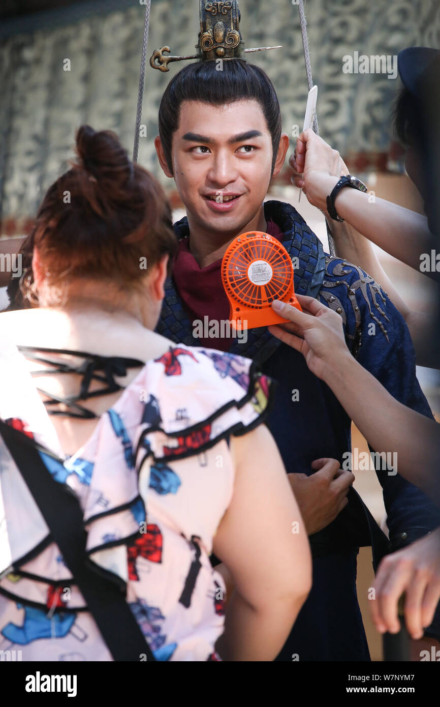 Taiwanese actor Chen Bolin is pictured during a filming session on set ...