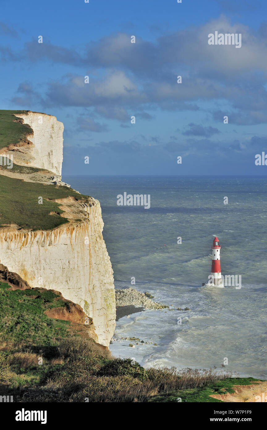 View over the eroded white chalk cliffs and lighthouse at Beachy Head ...