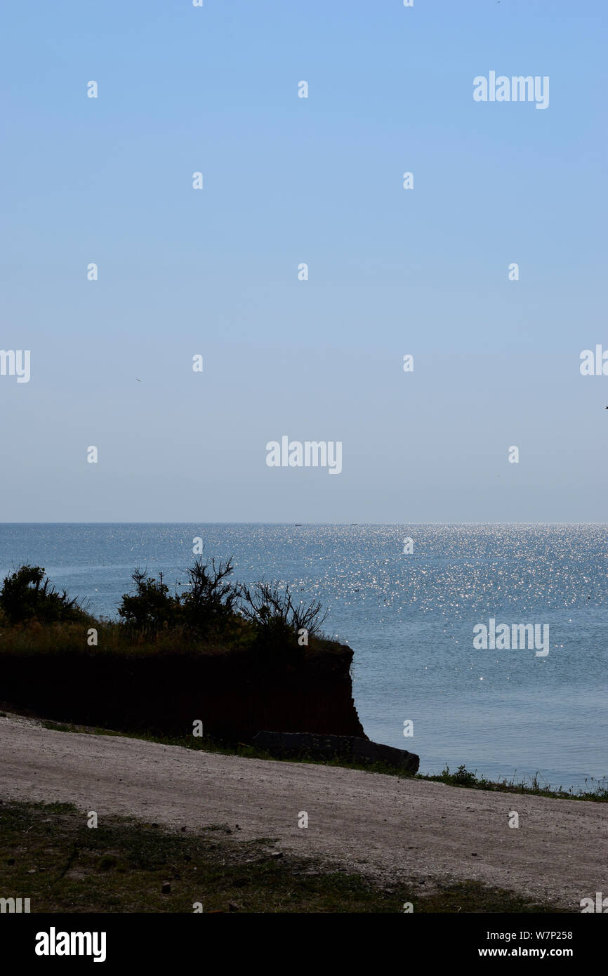 Steep cliff, seashore landscape. Cliff of clay and sea beach. Beautiful ...