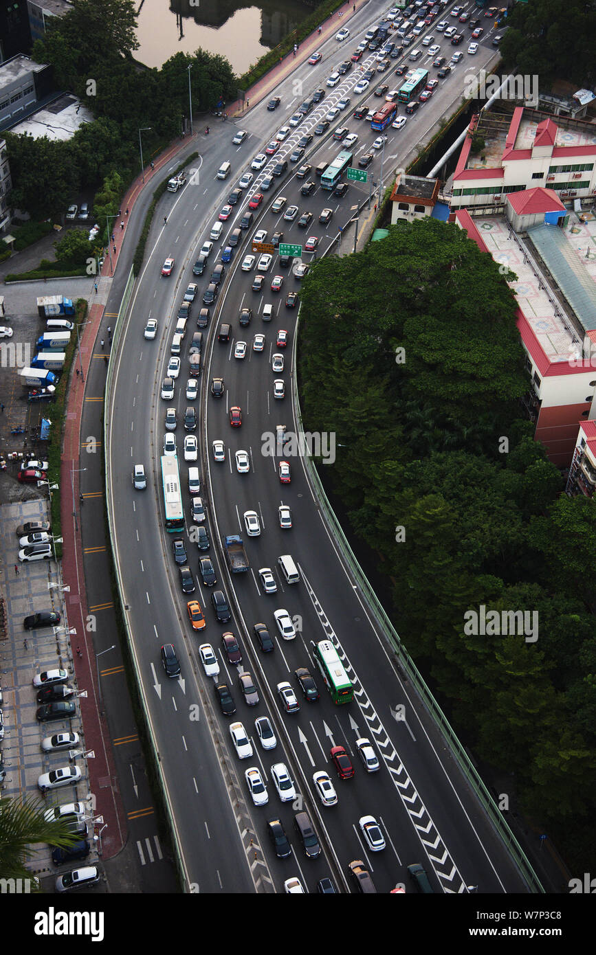 --FILE--Masses of vehicles move slowly on a road in a traffic jam ...