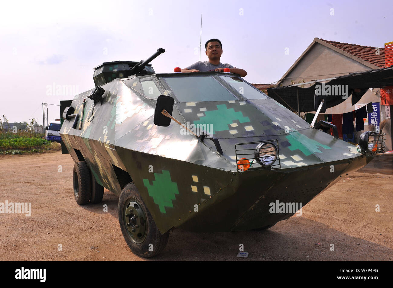 --FILE--Chinese veteran Shi Yanqiang is pictured with his home-made ...