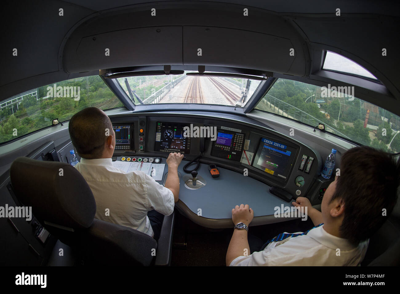 Drivers of a CRH2 (China Railway High-speed) bullet train are pictured ...