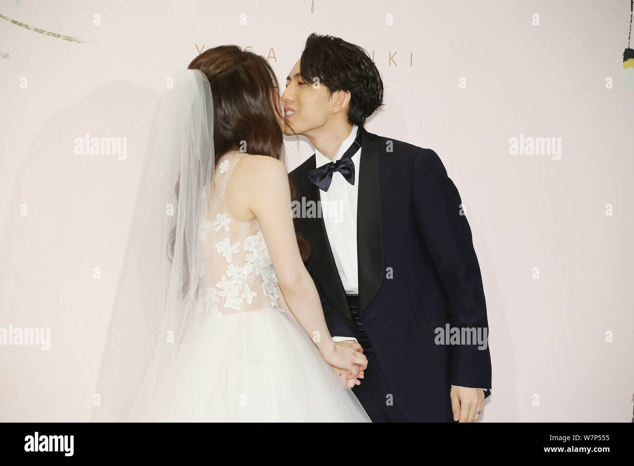 **TAIWAN OUT**Taiwanese singer Yoga Lin, right, kisses his singer wife ...