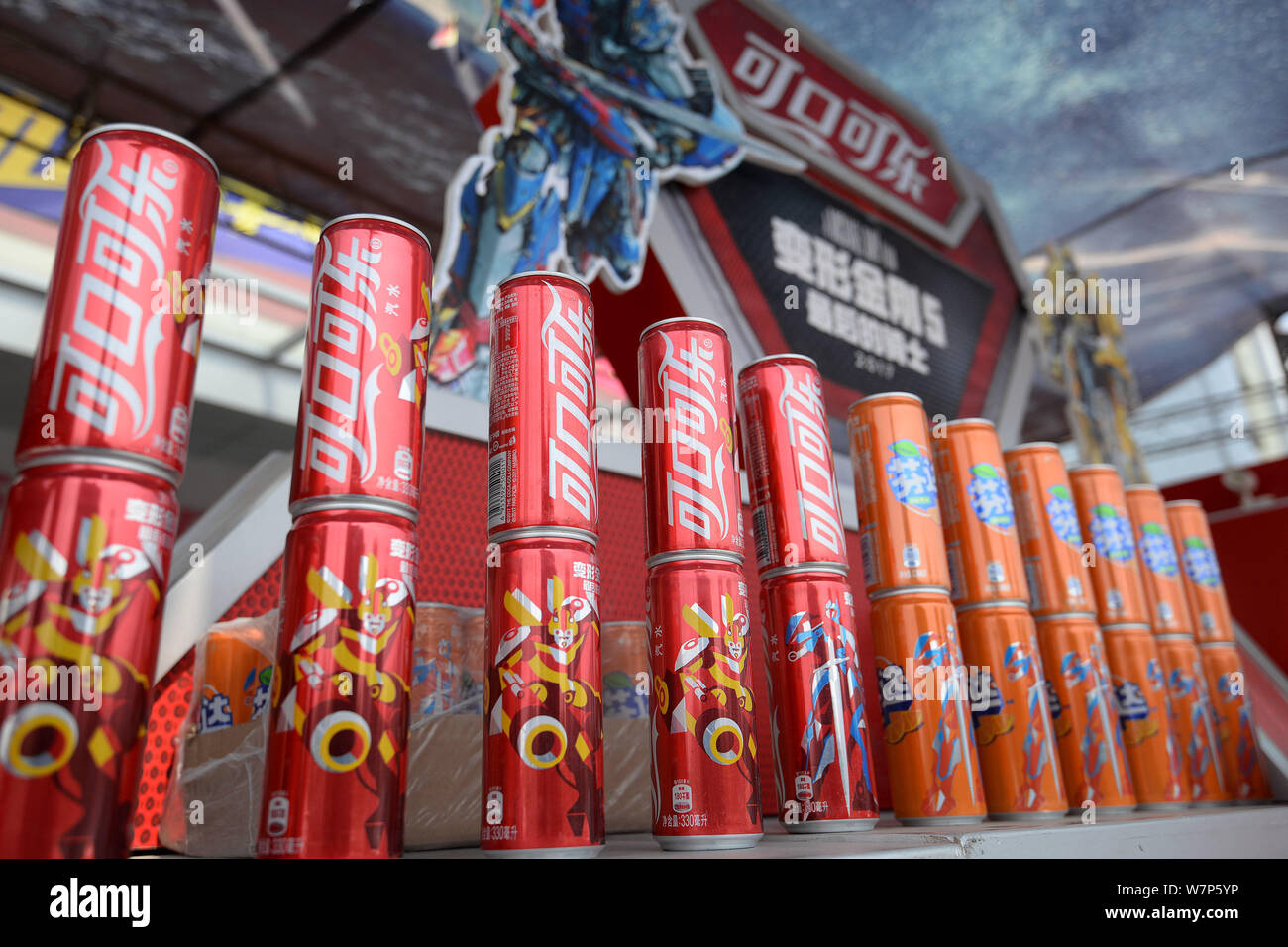 Cans of Coca Cola and Fanta soft drinks featuring cartoons of Bumblebee ...