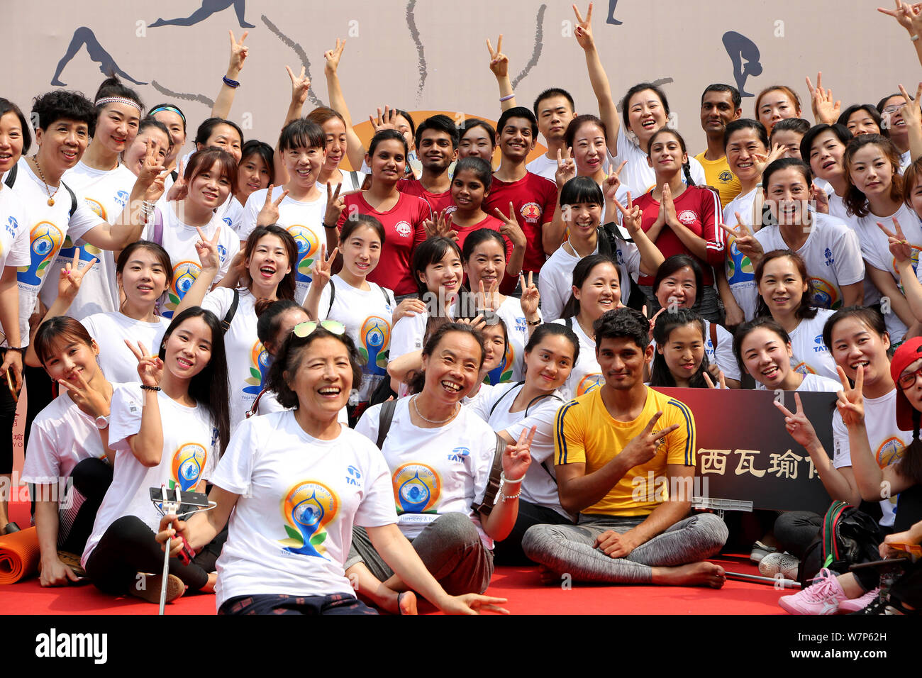 Chinese enthusiasts perform yoga to mark the mark the International ...