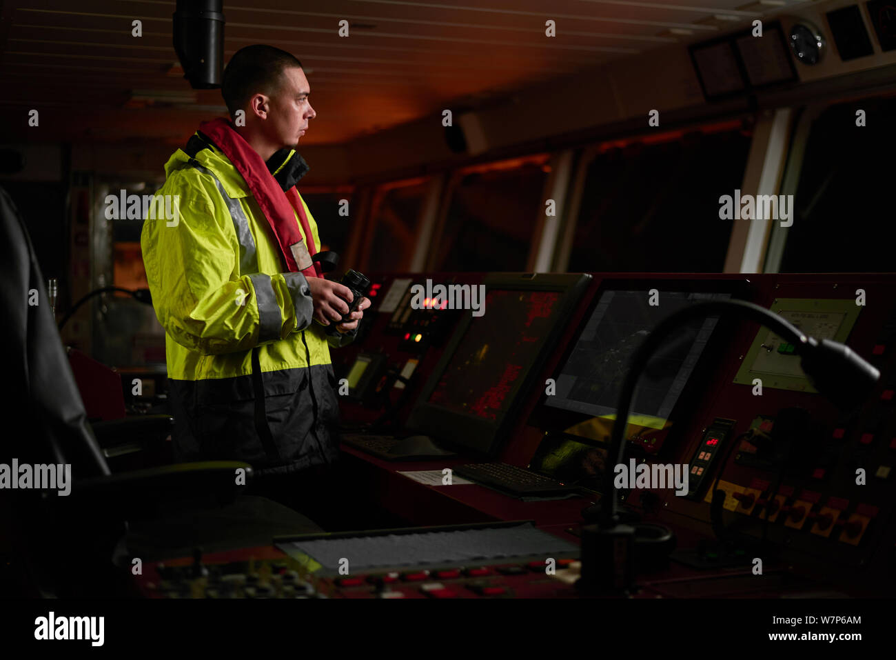 Navigator. pilot, captain as part of ship crew performing daily duties ...