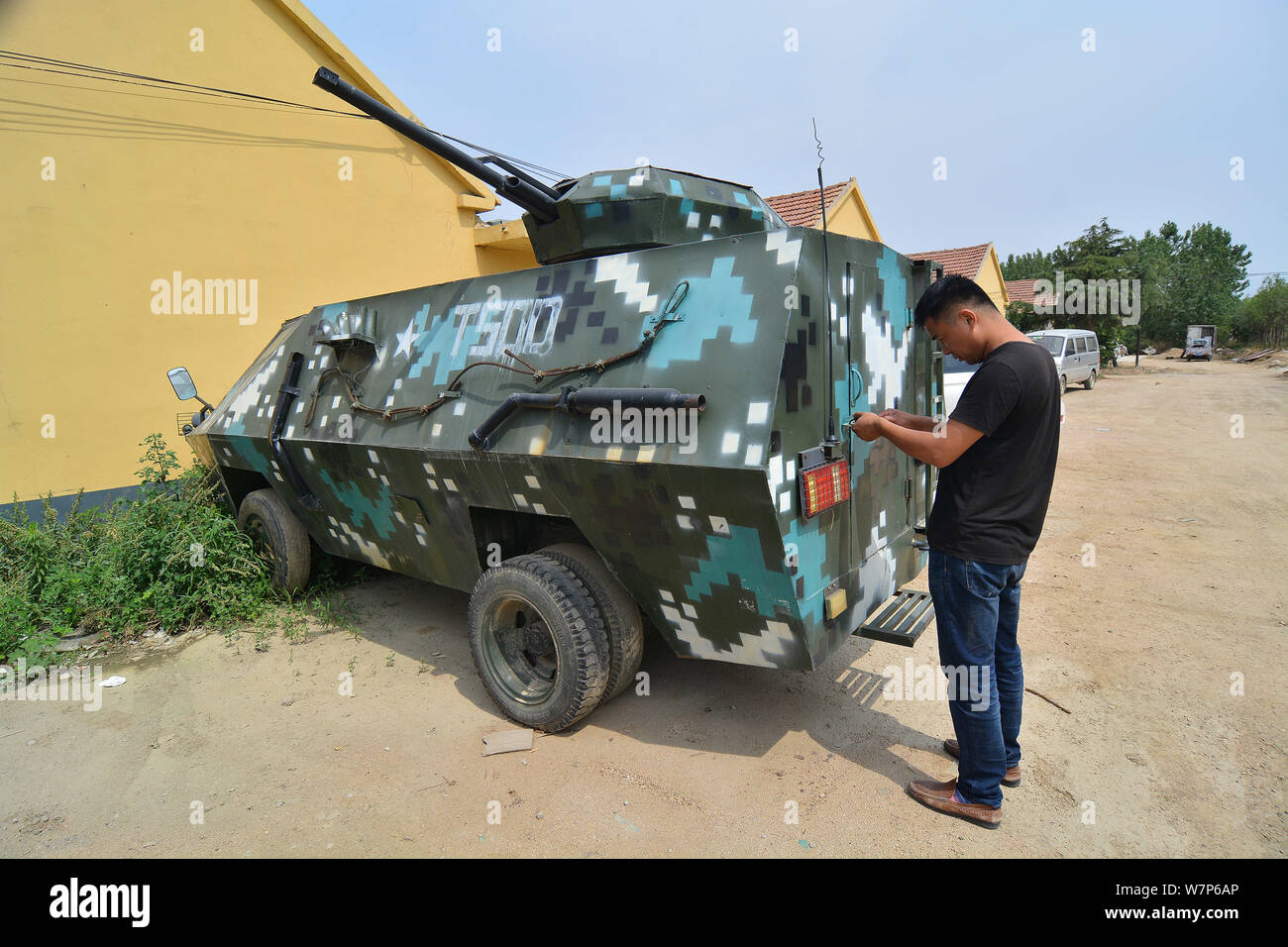 Chinese veteran Shi Yanqiang checks his home-made armored vehicle ...