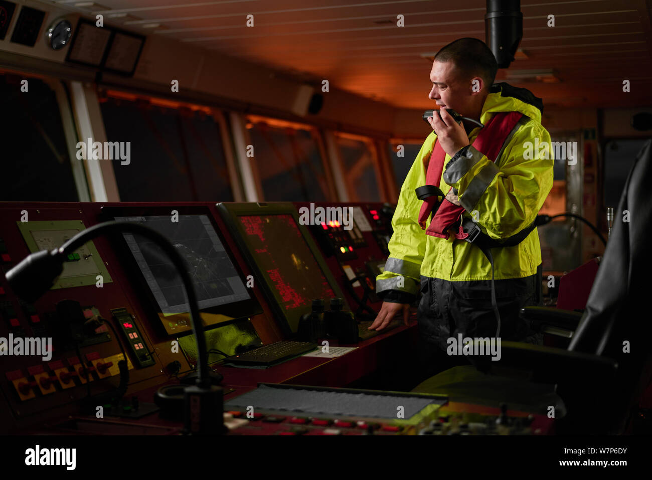 Navigator. pilot, captain as part of ship crew performing daily duties ...