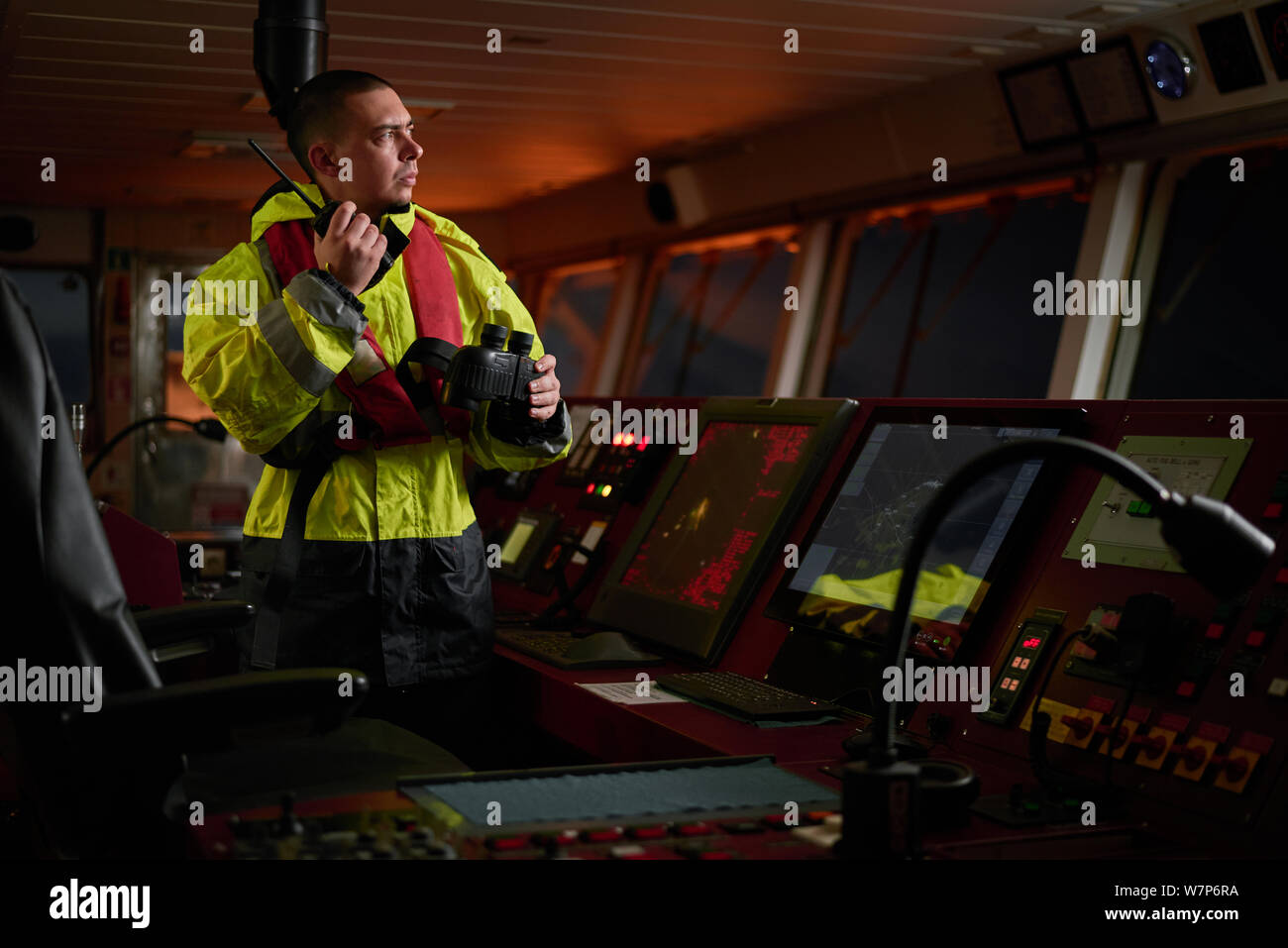 Navigator. pilot, captain as part of ship crew performing daily duties ...