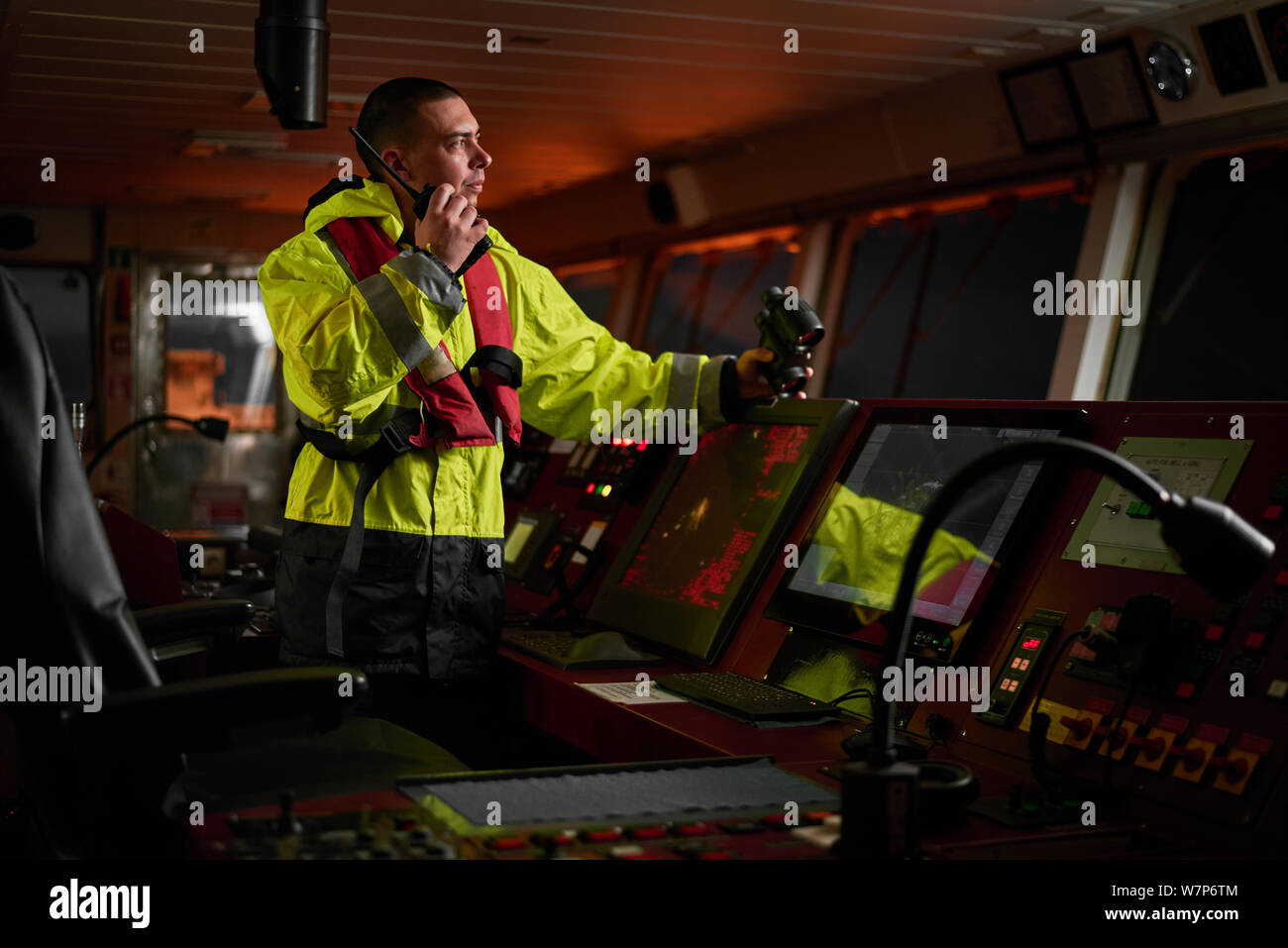 Navigator. pilot, captain as part of ship crew performing daily duties ...