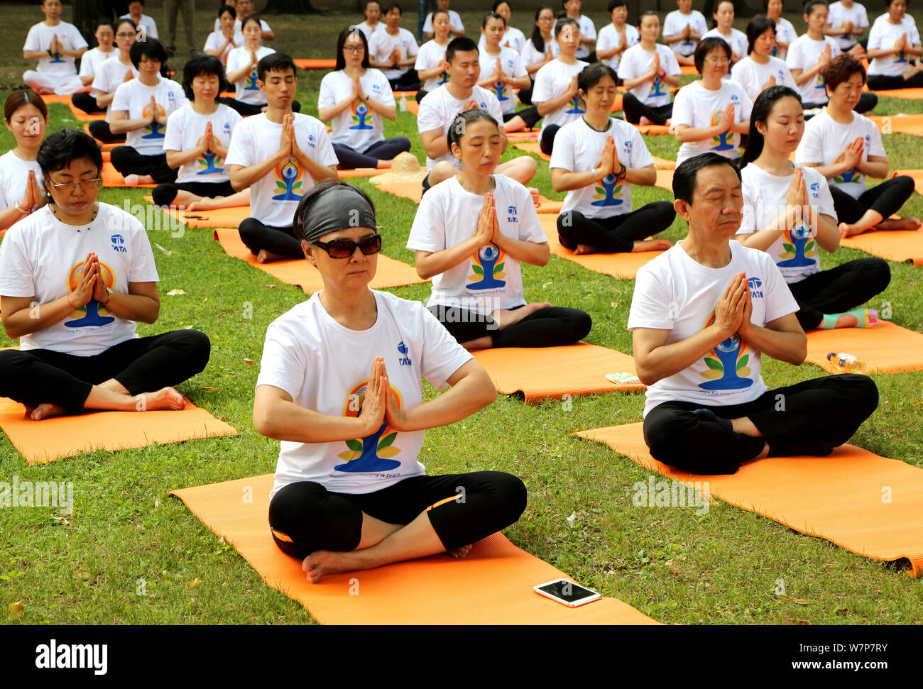Chinese enthusiasts perform yoga to mark the mark the International ...