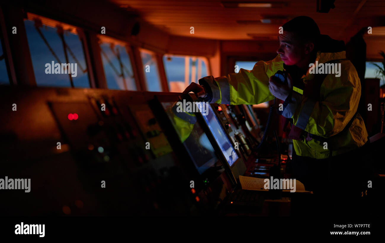 Navigator. pilot, captain as part of ship crew performing daily duties ...