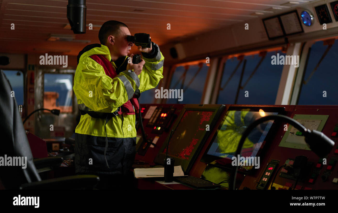 Navigator. pilot, captain as part of ship crew performing daily duties ...