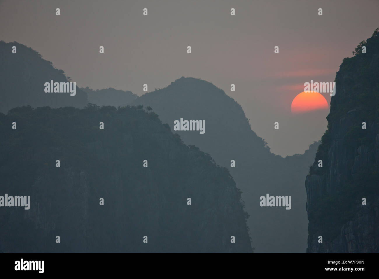 Sunset in Ha Long Bay, a UNESCO World Heritage Site and popular travel ...