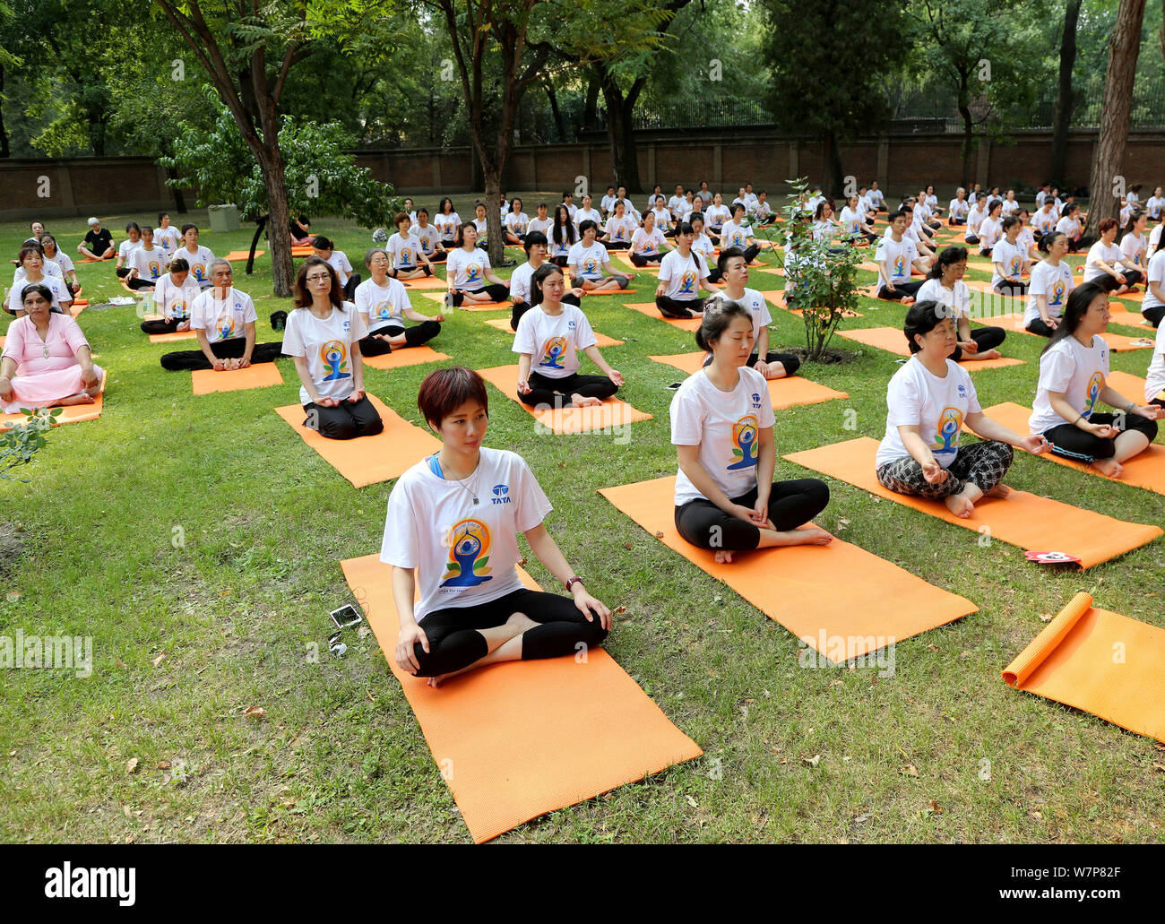 Chinese enthusiasts perform yoga to mark the mark the International ...