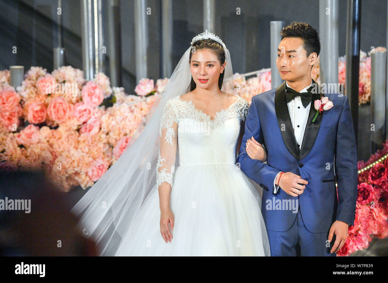 Chinese divers He Zi, left, and Qin Kai attend their wedding ceremony ...