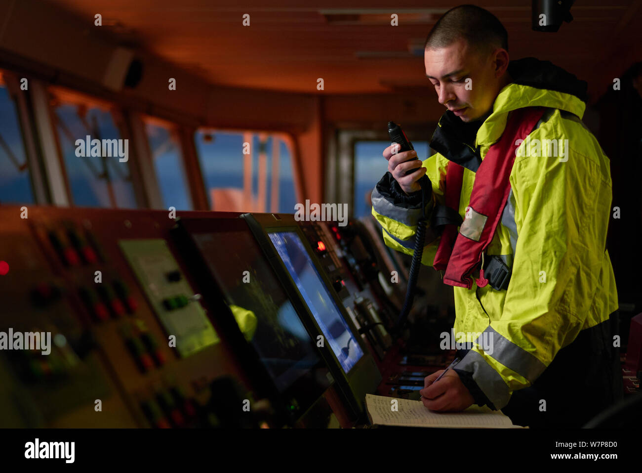 Navigator. pilot, captain as part of ship crew performing daily duties ...
