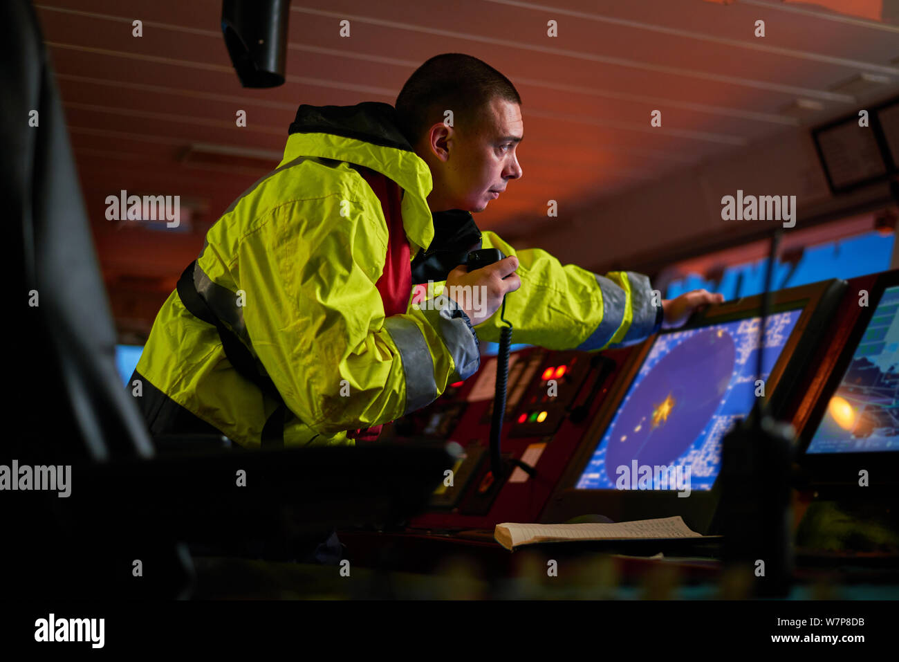 Navigator. pilot, captain as part of ship crew performing daily duties ...