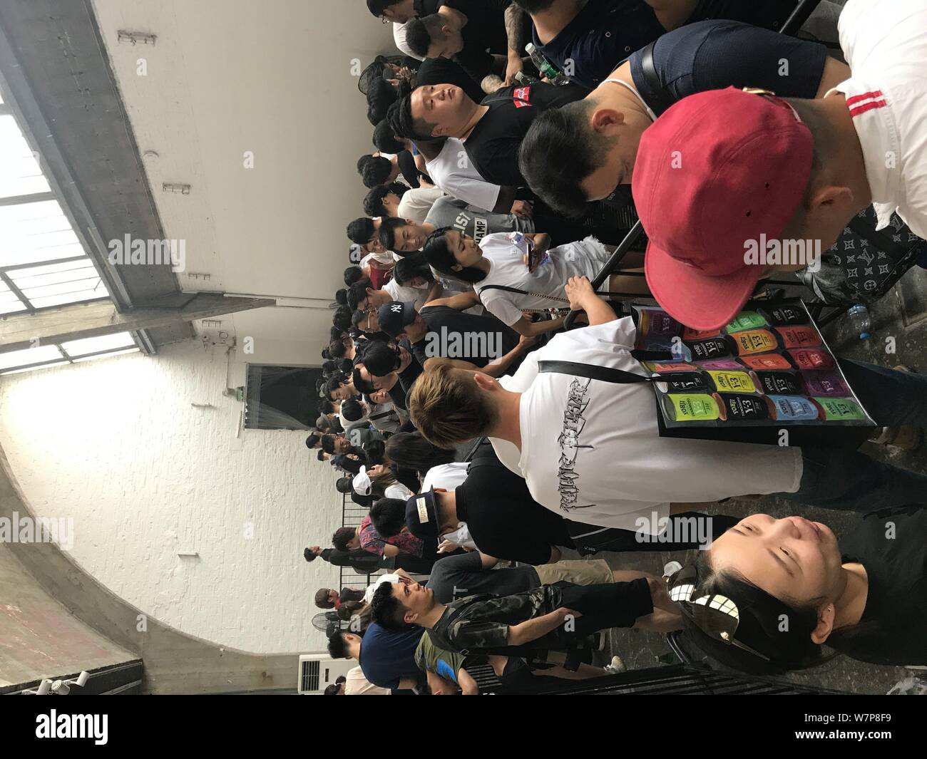 Customers queue up in front of a boutique of Louis Vuitton (LV) selling ...