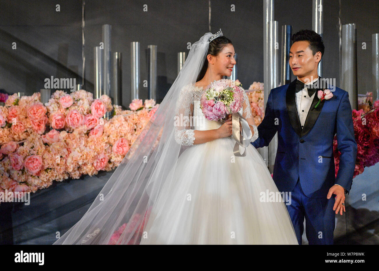 Chinese divers He Zi, left, and Qin Kai attend their wedding ceremony ...