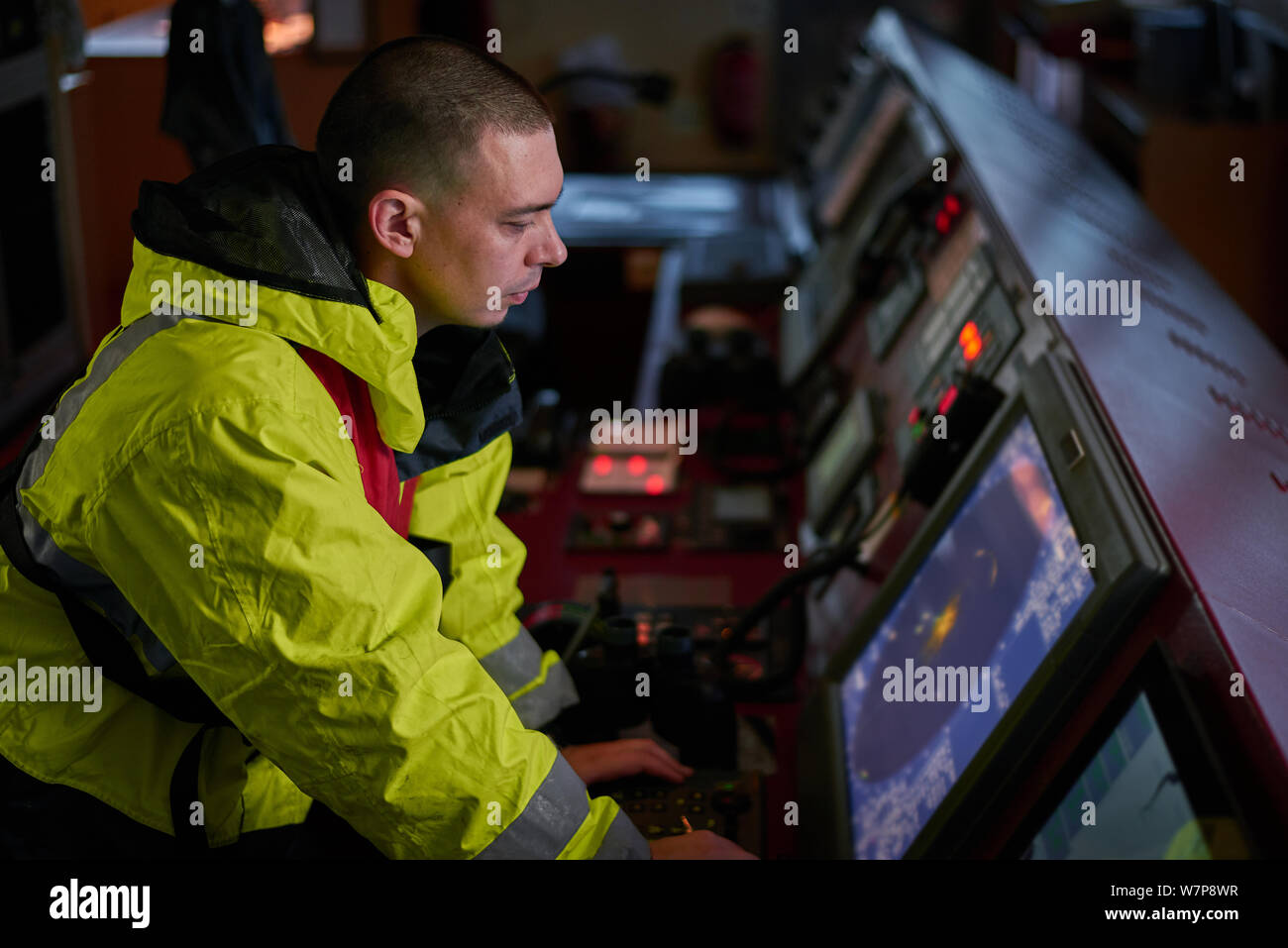 Navigator. pilot, captain as part of ship crew performing daily duties ...