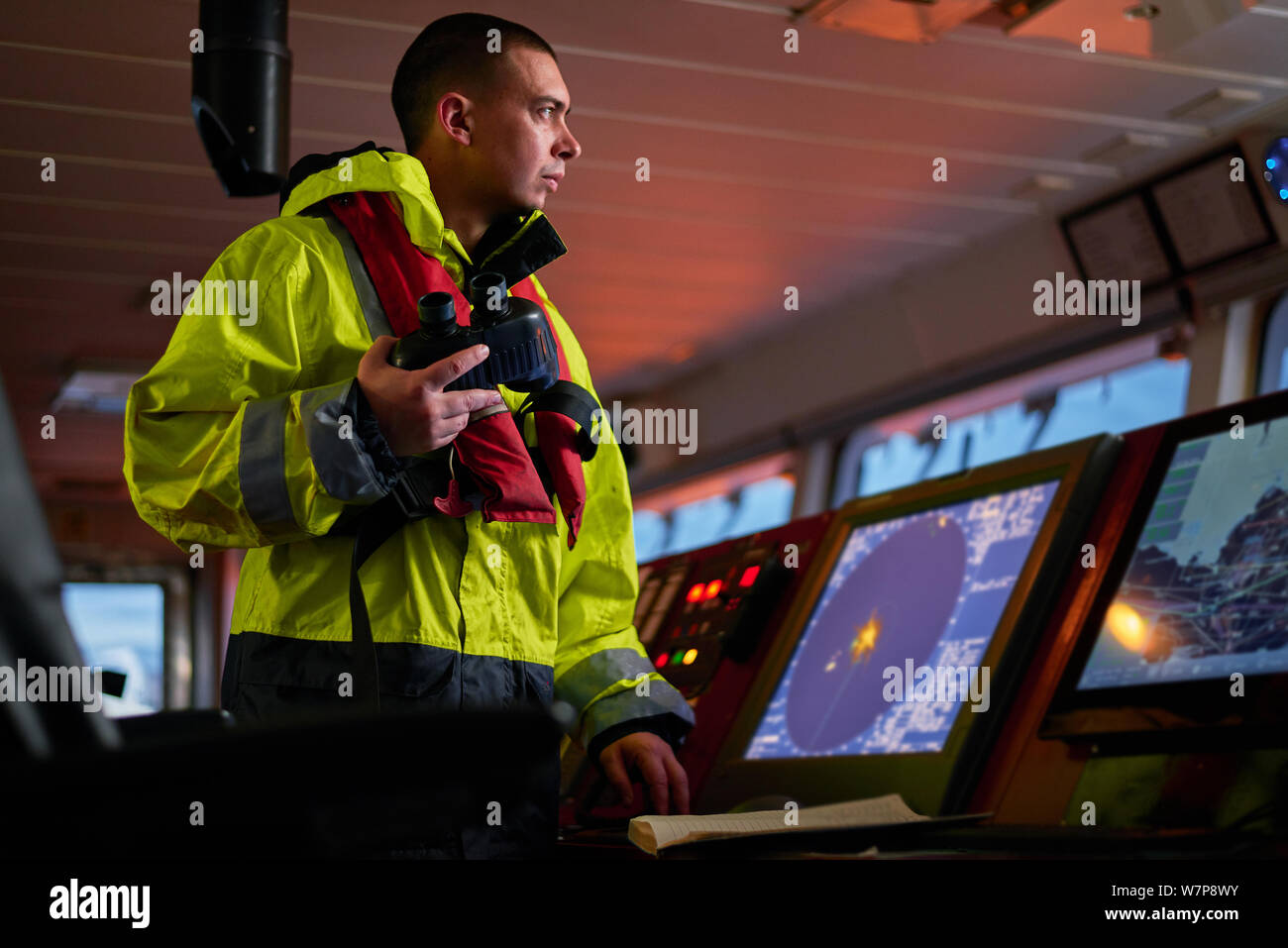 Navigator. pilot, captain as part of ship crew performing daily duties ...