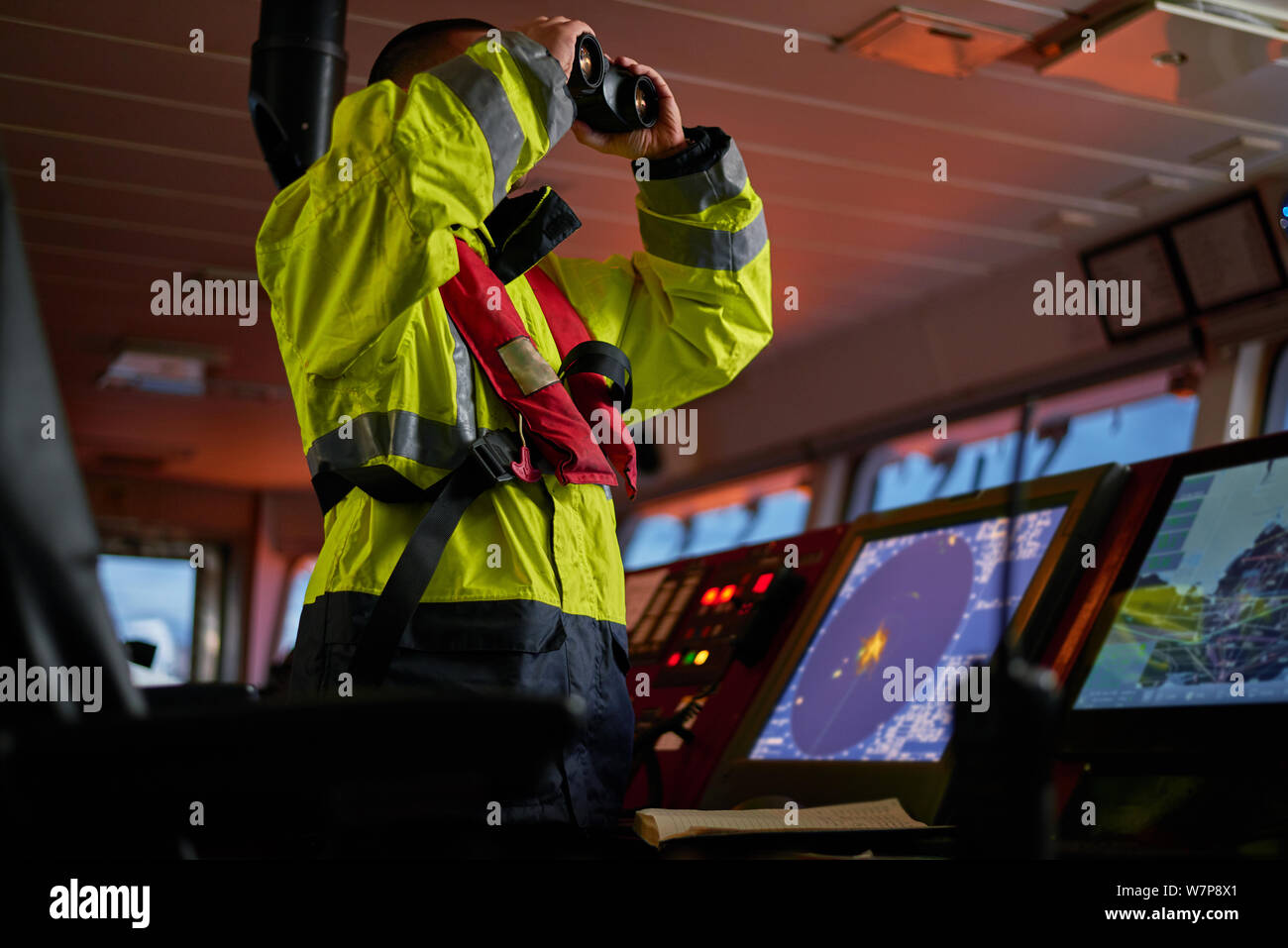 Navigator. pilot, captain as part of ship crew performing daily duties ...